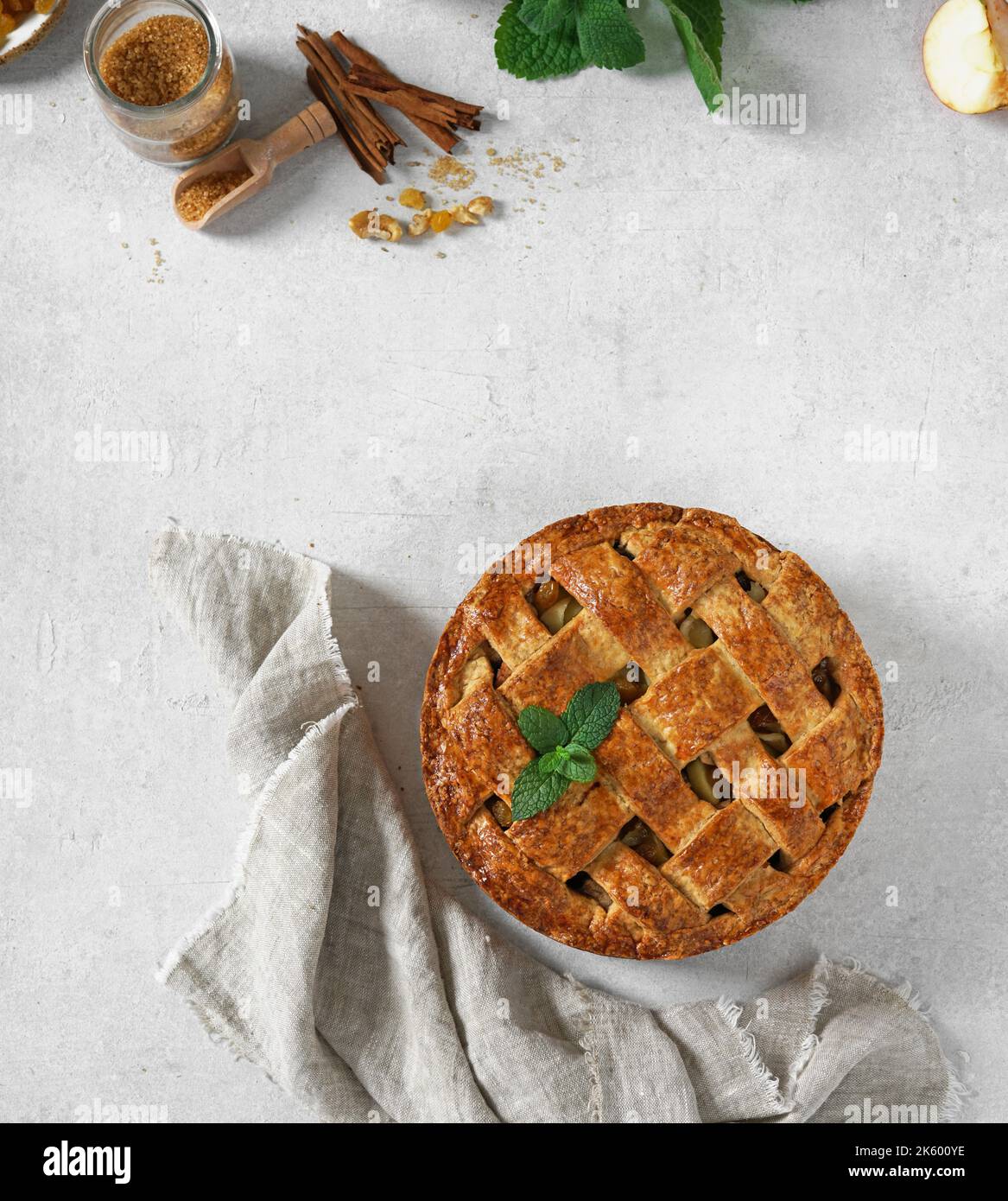 Homemade appeltaart pie and ingredients on a light table. top view ...