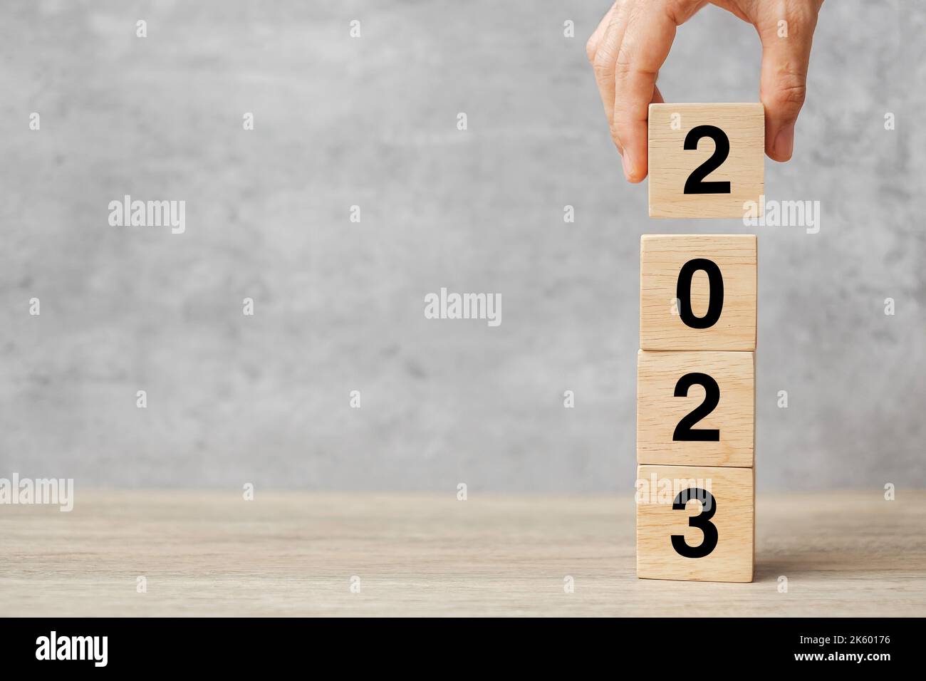 hand holding block 2023 text on table. Resolution, strategy, plan, goal ...