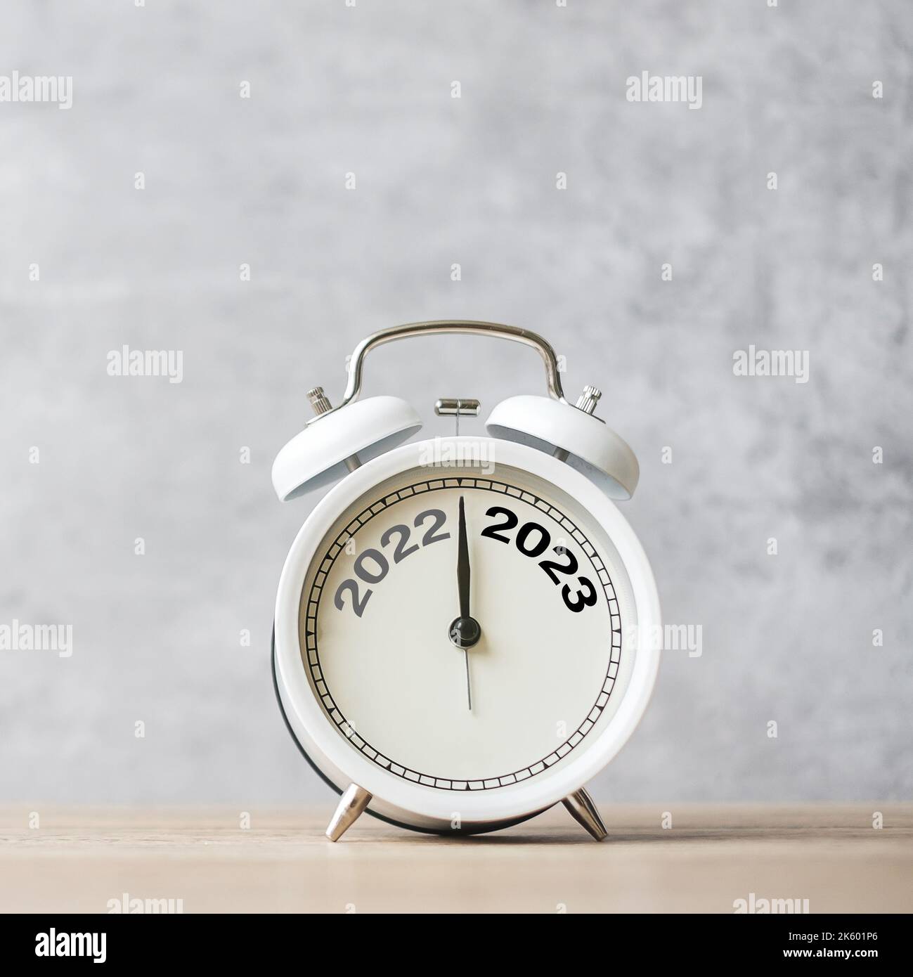 Happy New Year with vintage alarm clock and 2022 change to 2023 number ...