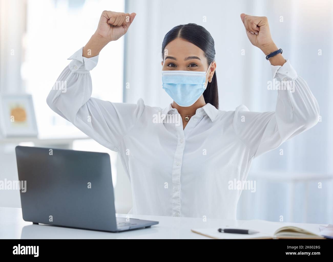 Business woman in office, covid mask and celebrate success at work ...