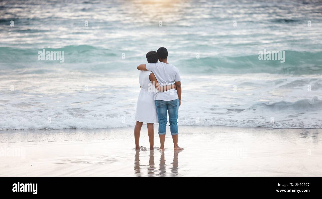 Young african american couple spending a day at the sea together ...