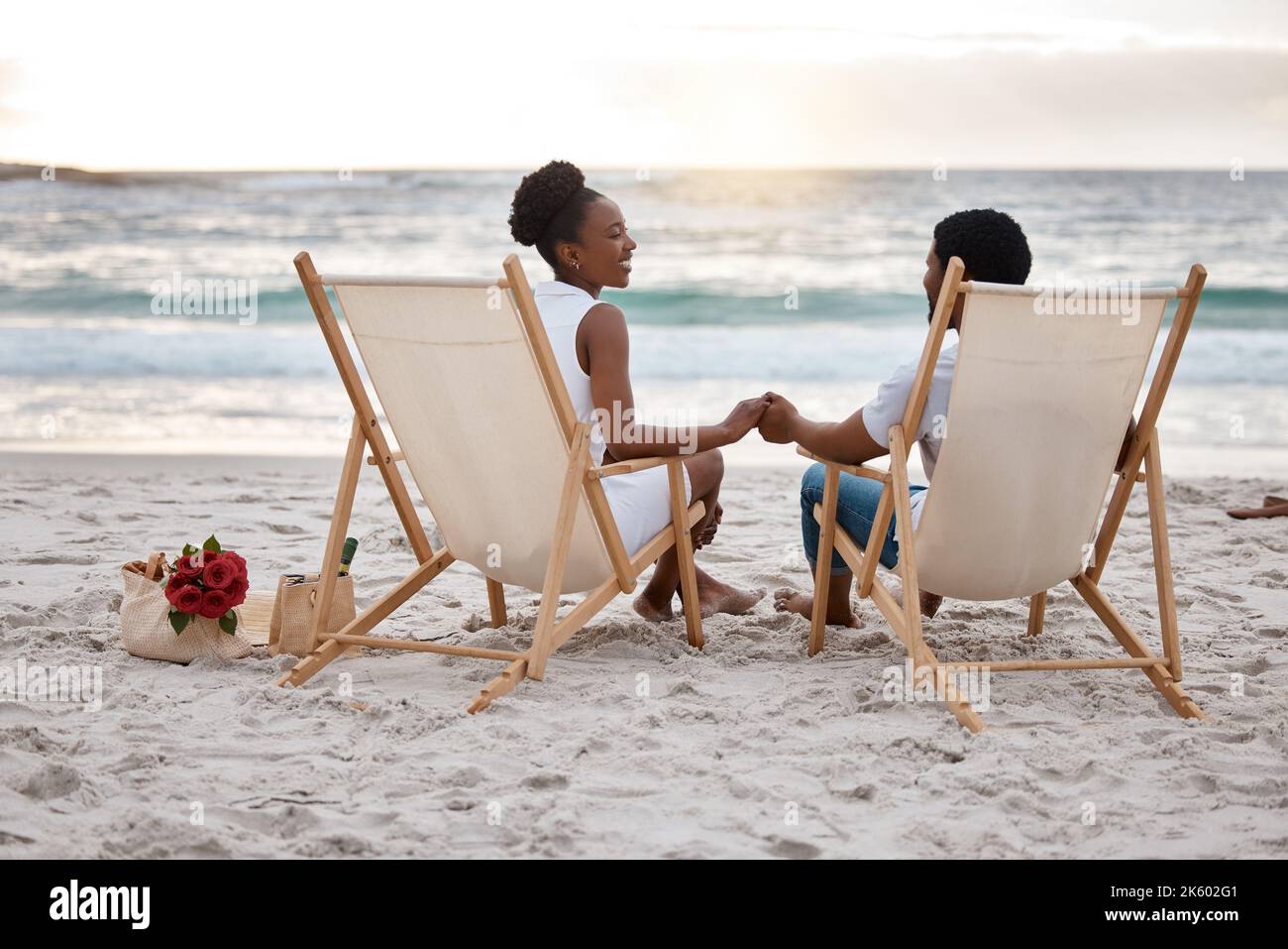 Couple Holding Hands On Beach