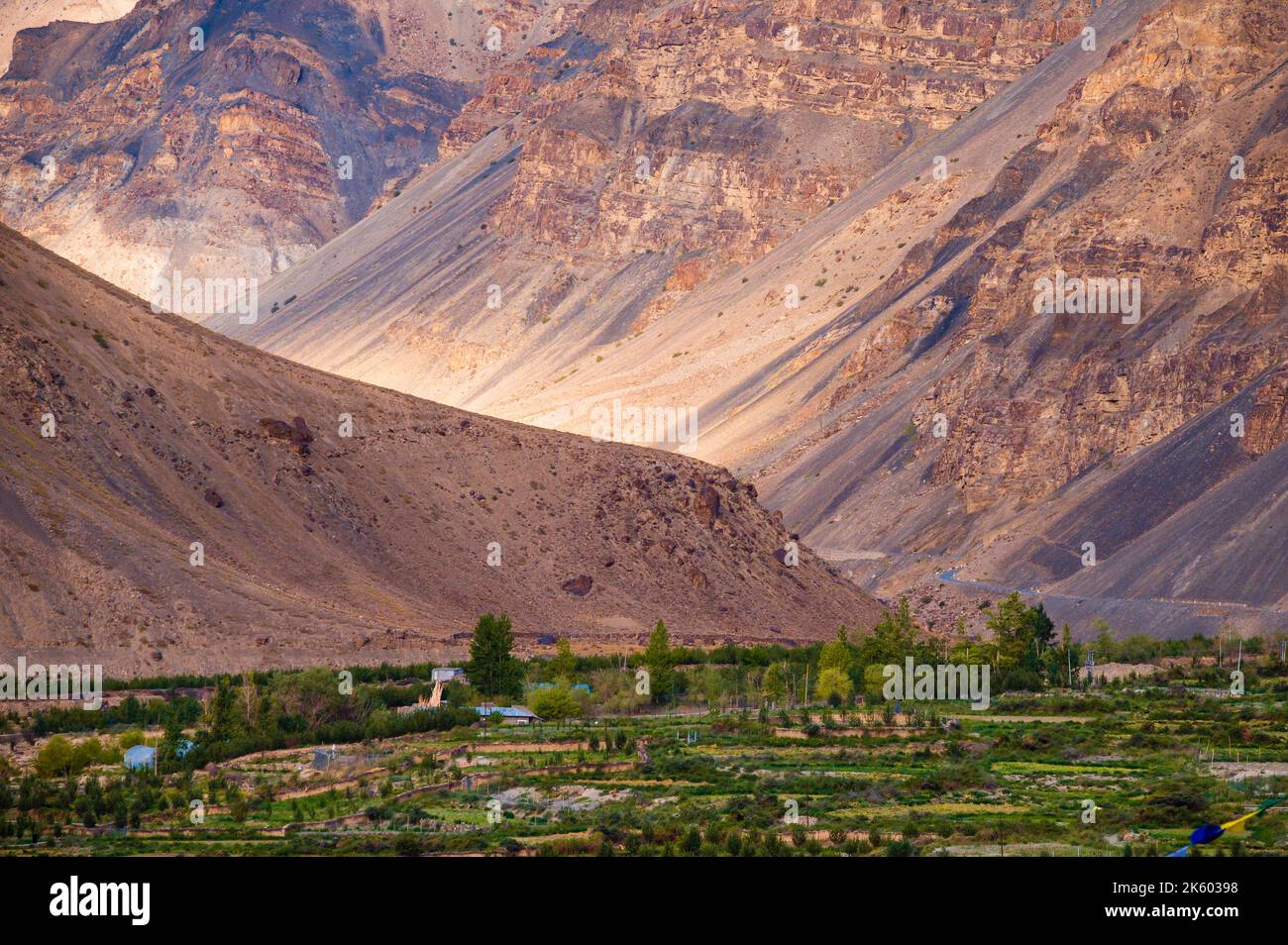 A scenic view of the green fields and ancient monastery in the ...