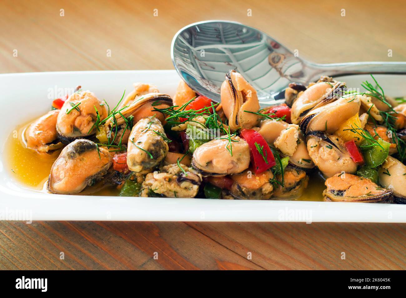 Greek style mussels in white wine and olive oil sauce (selective focus ...