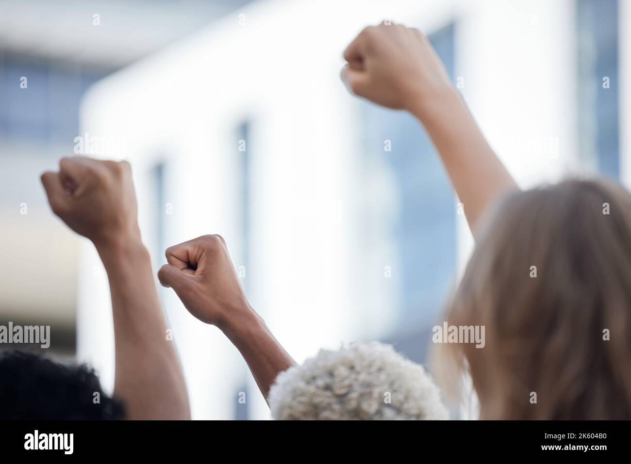 Fist, activism and crowd solidarity protest against racism and ...