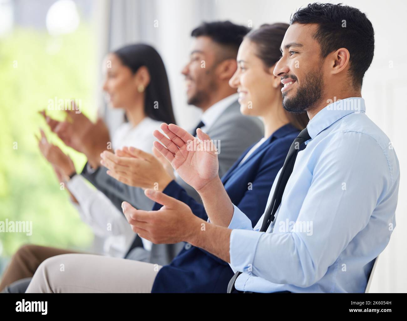 Group of diverse businesspeople clapping and celebrating success during ...