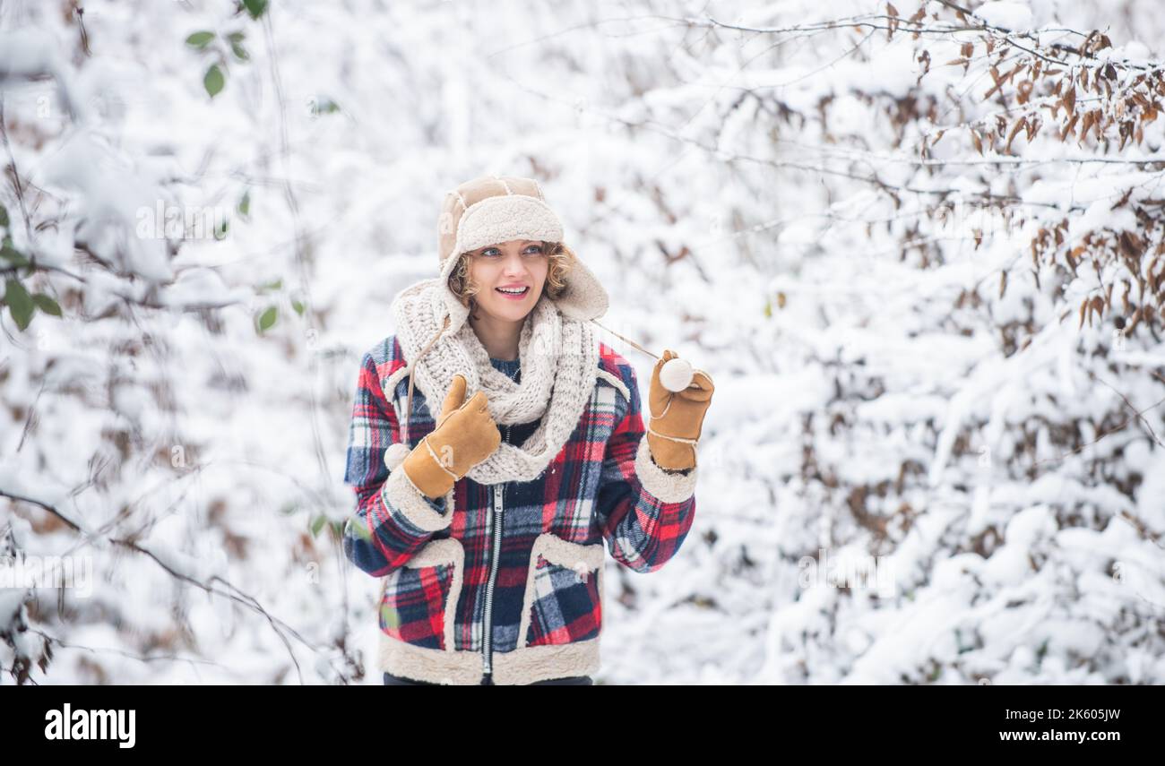 Woman wear warm accessories stand in snowy nature. Winter fashion ...