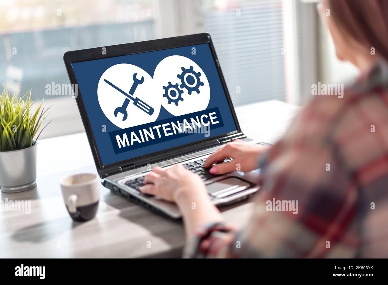 Laptop screen displaying a maintenance service concept Stock Photo - Alamy