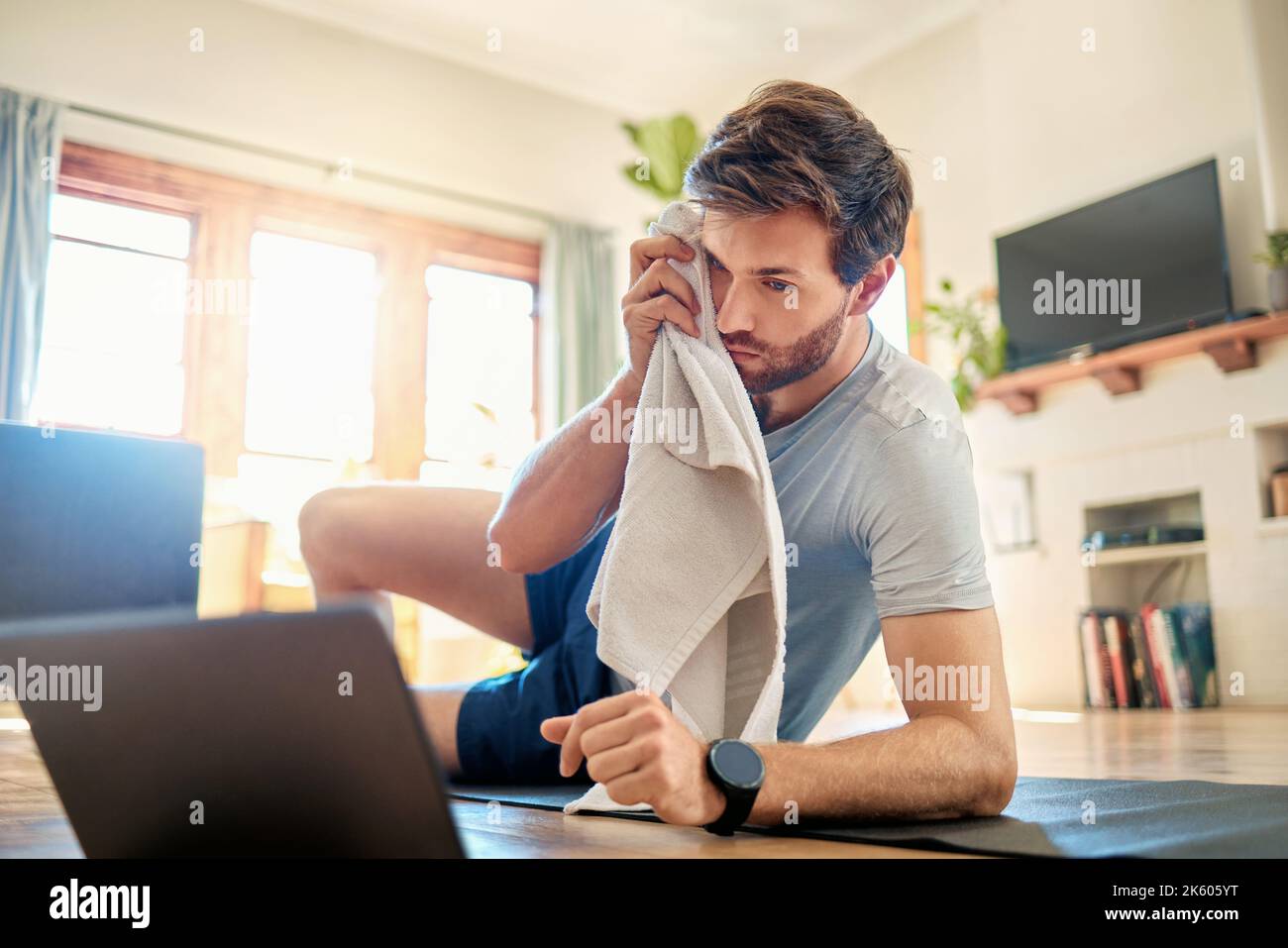 Muscular young man wiping off sweat hi-res stock photography and images ...