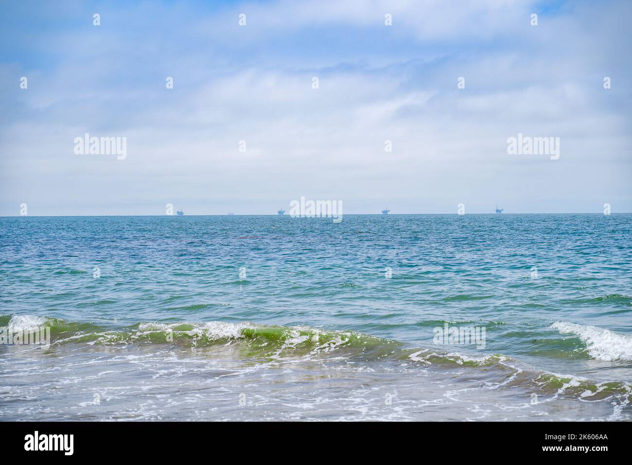 Offshore Oil rigs on the ocean horizon view from Butterfly beach Santa ...