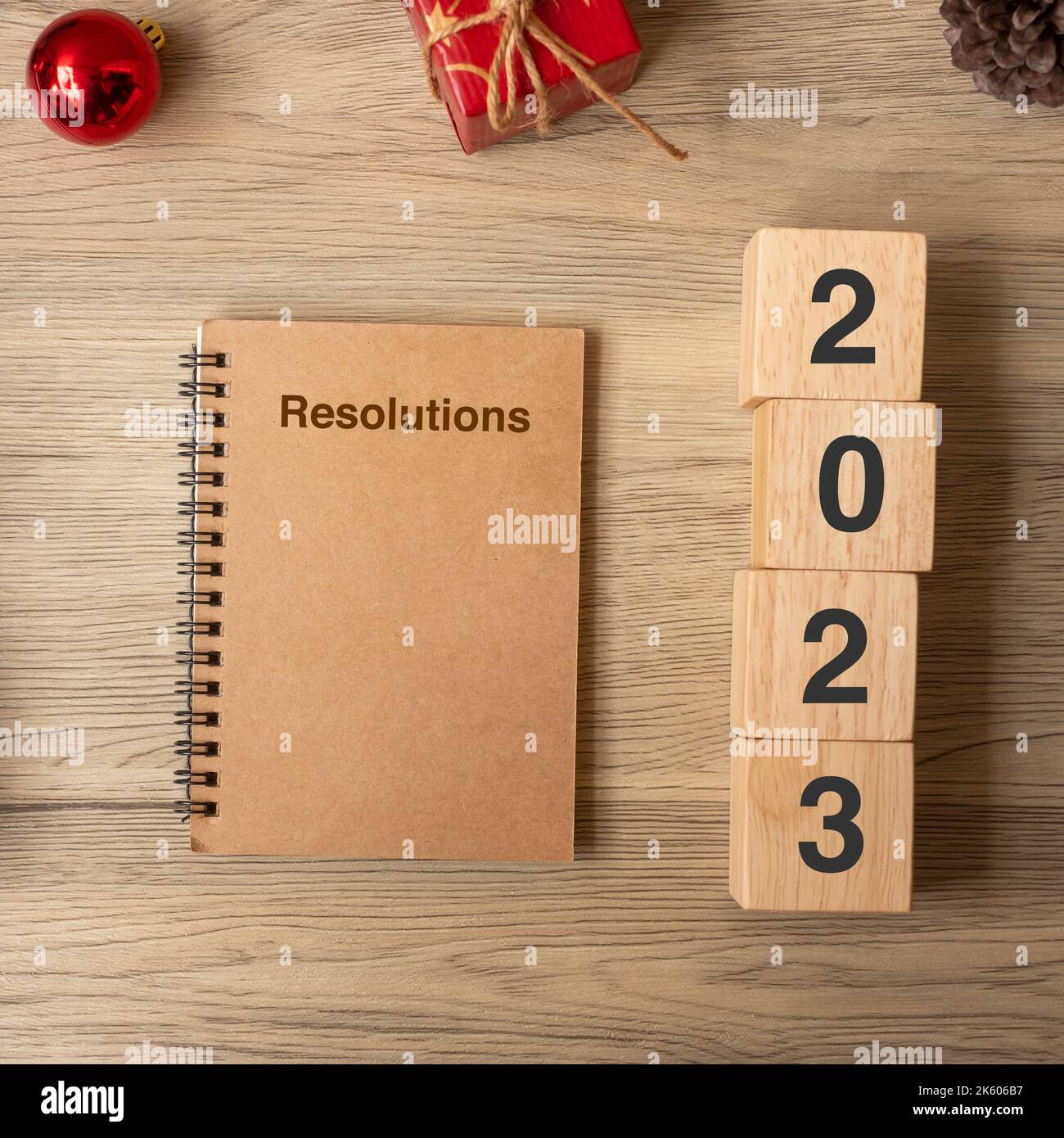 2023 New Year with notebook, Christmas gift and pen on wood table. Xmas ...