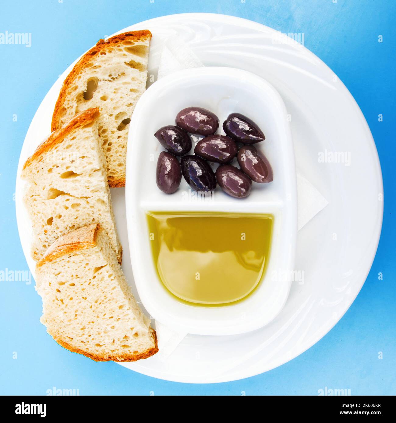 Traditional Greek starter - olives with olive oil and bread (selective ...