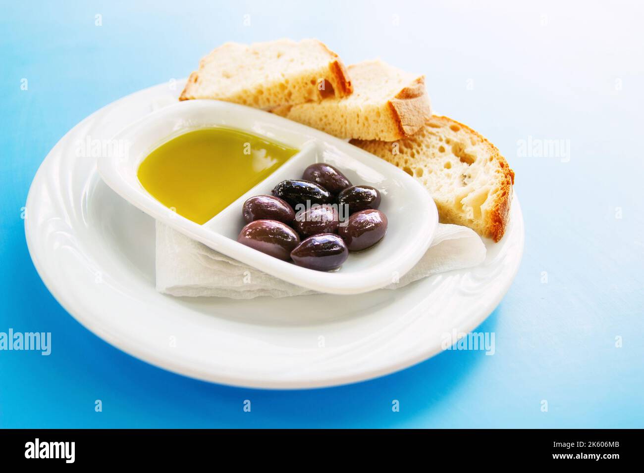 Traditional Greek starter - olives with olive oil and bread (selective ...