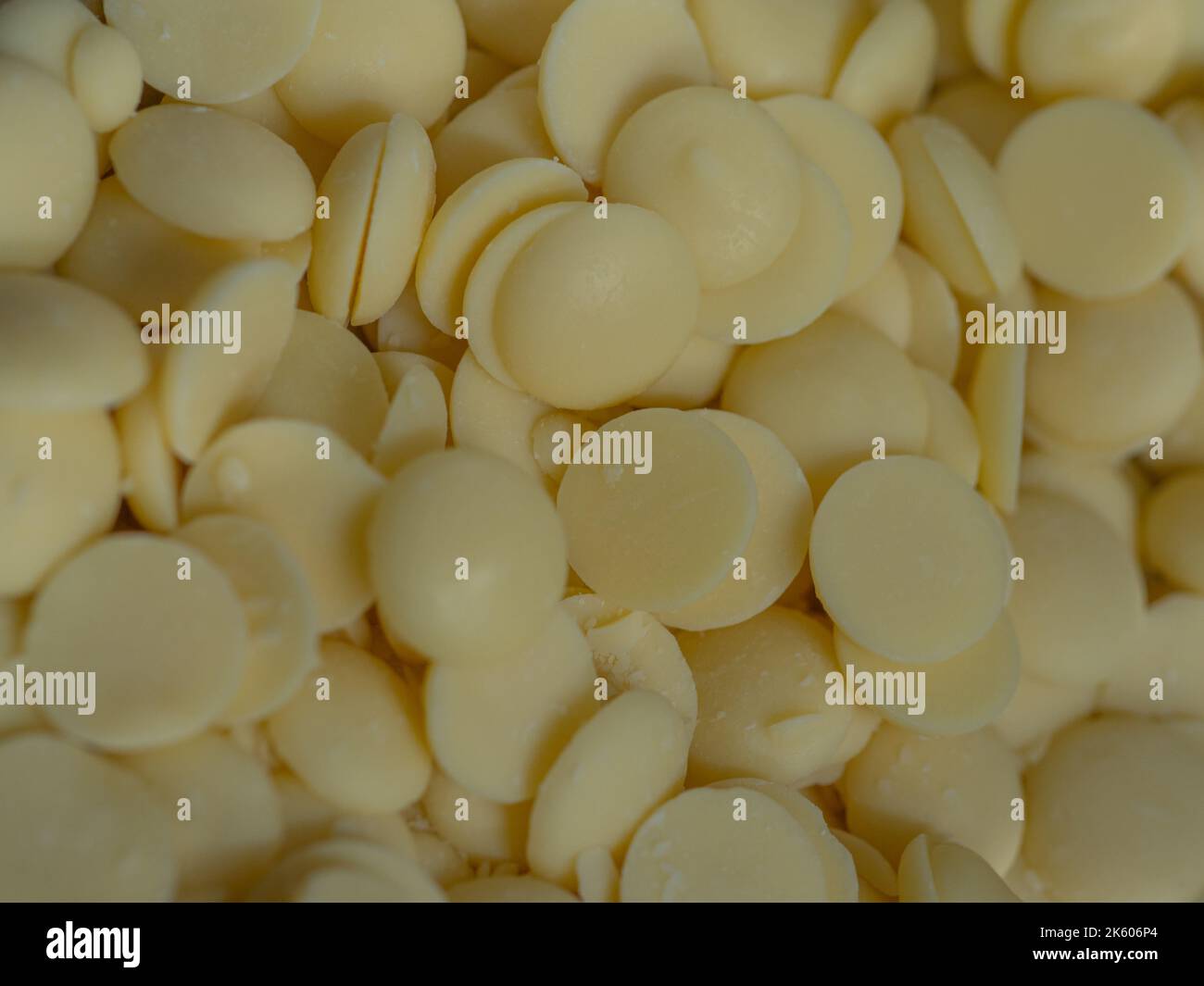 white chocolate drops for cake topping Stock Photo - Alamy