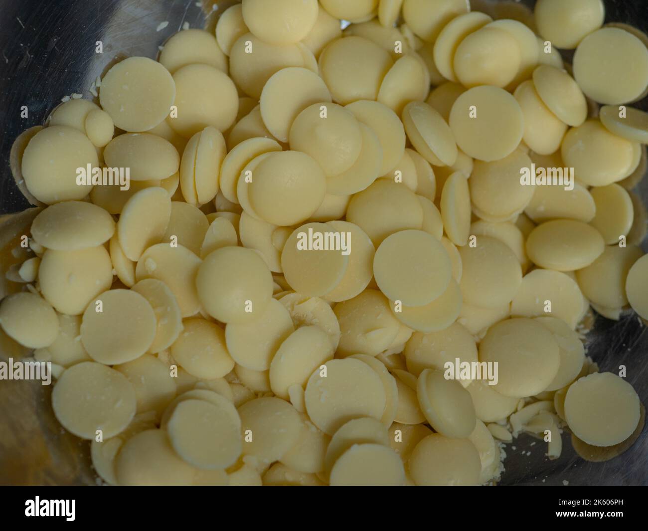 white chocolate drops for cake topping Stock Photo - Alamy