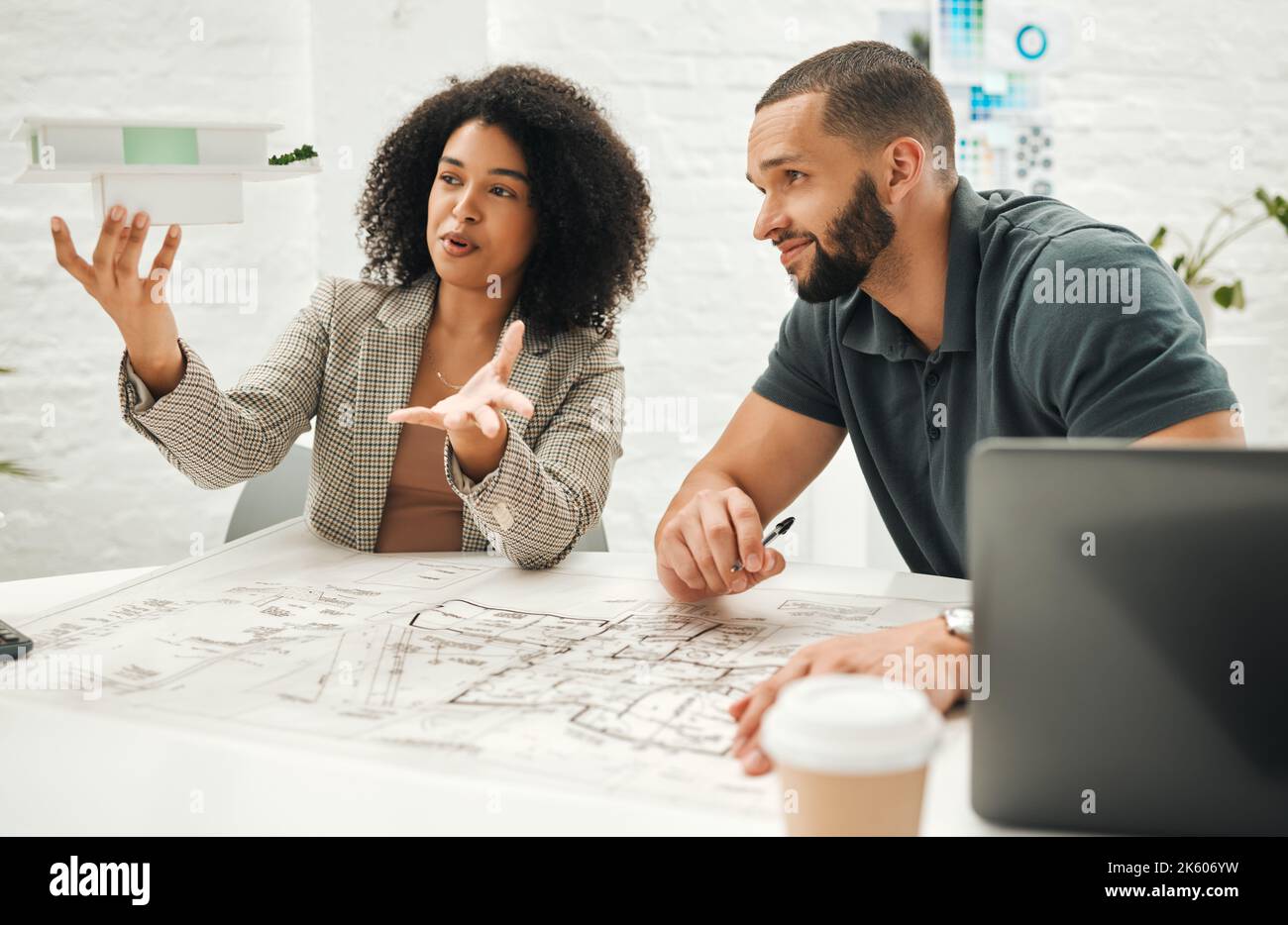 architect coworkers planning a building together. Businesspeople ...