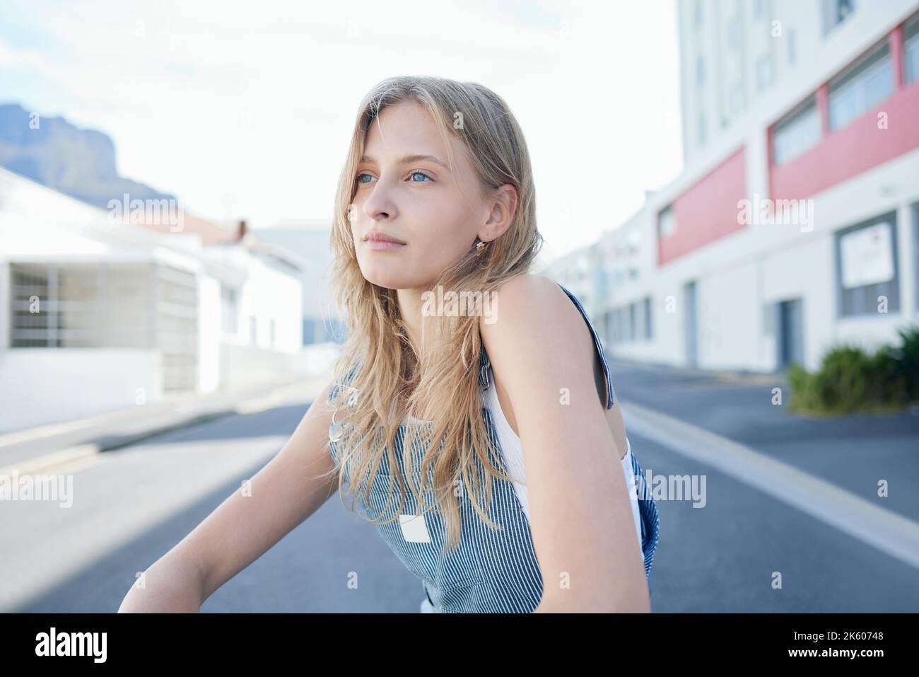 Thinking, vision and girl in the street in city, sitting on the road in ...