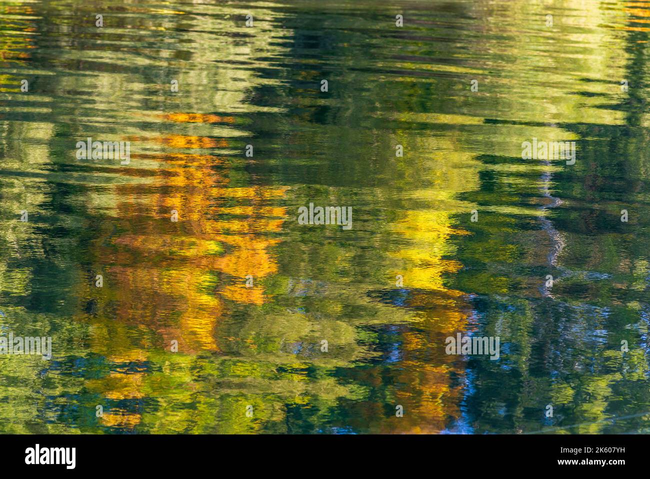 beautiful river reflection autumn Abstract background rippled water ...