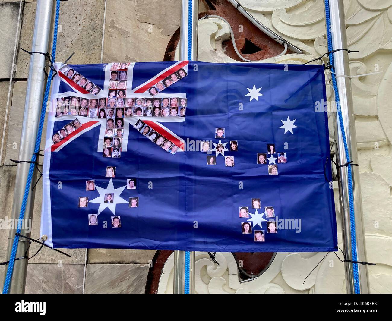 Kuta, Indonesia. 10th Oct, 2022. An Australian flag with photos of the ...