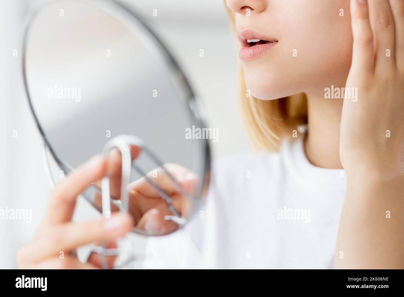 beauty care skin dermatology woman face mirror Stock Photo - Alamy