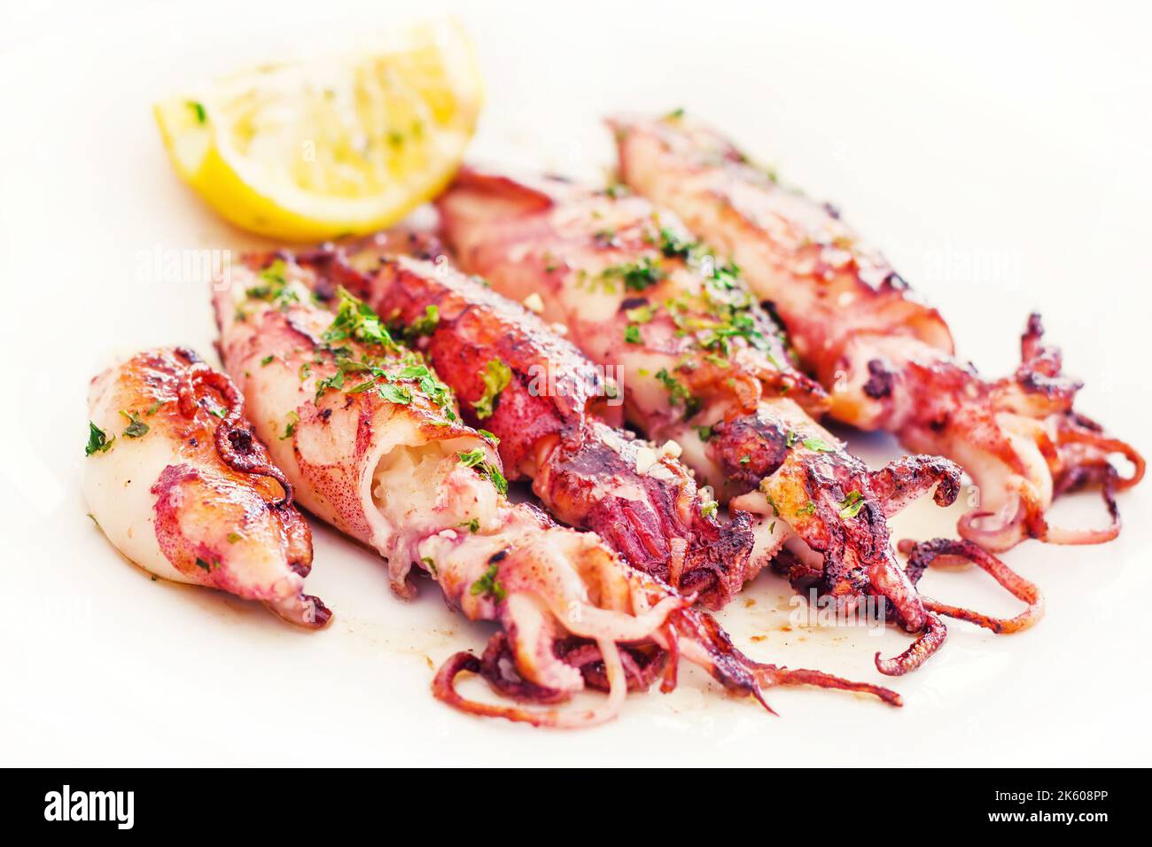 Fresh Adriatic squid in buzara sauce (shallow dof Stock Photo - Alamy