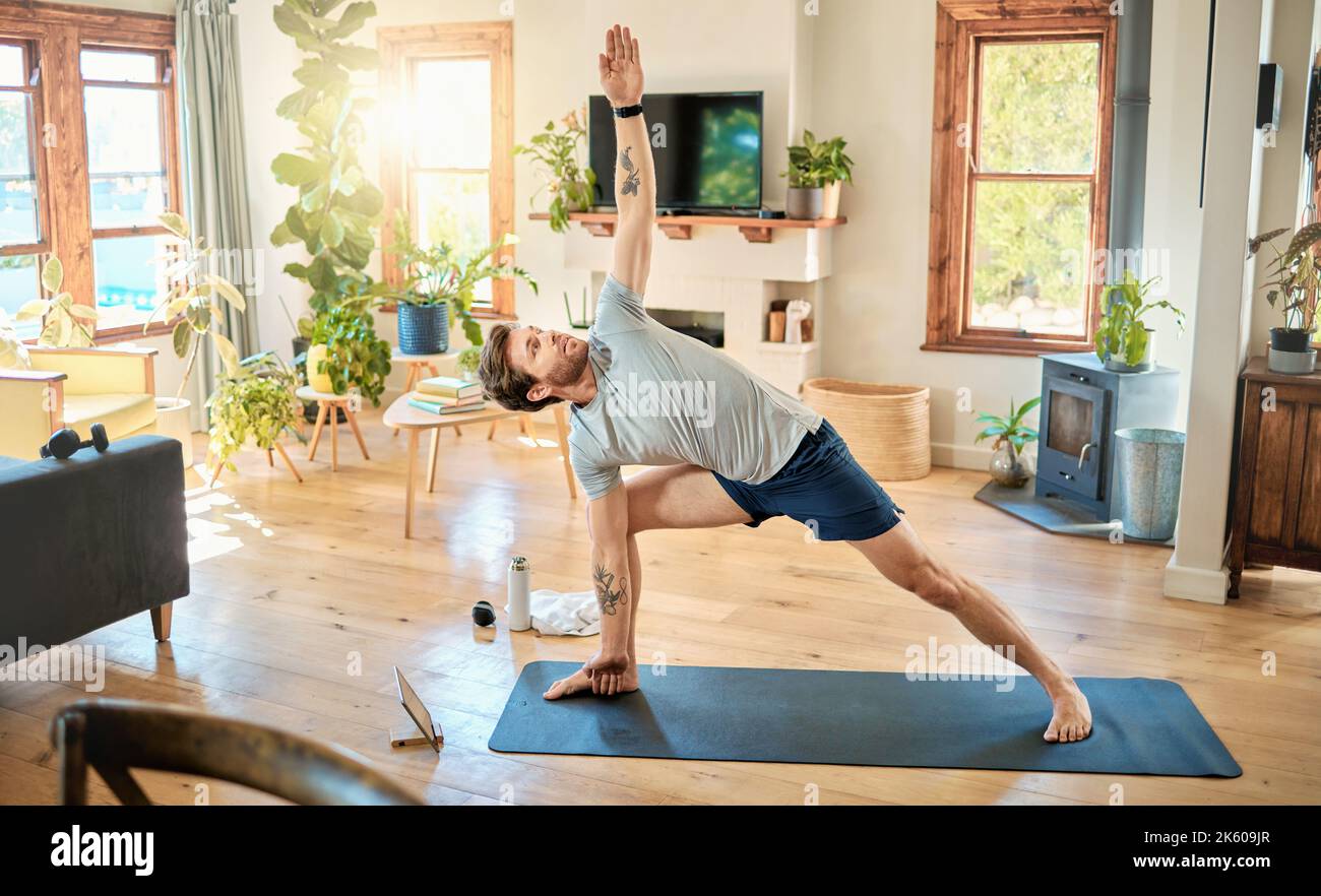 One fit young caucasian man doing extended revolved crescent lunge ...