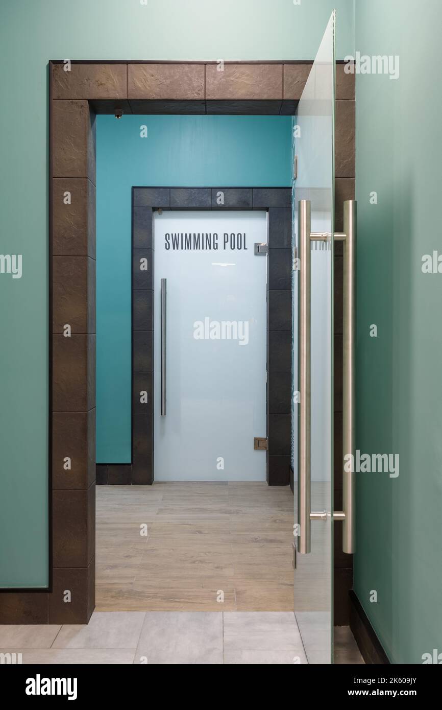 Closed stylish front door with inscription swimming pool in English ...