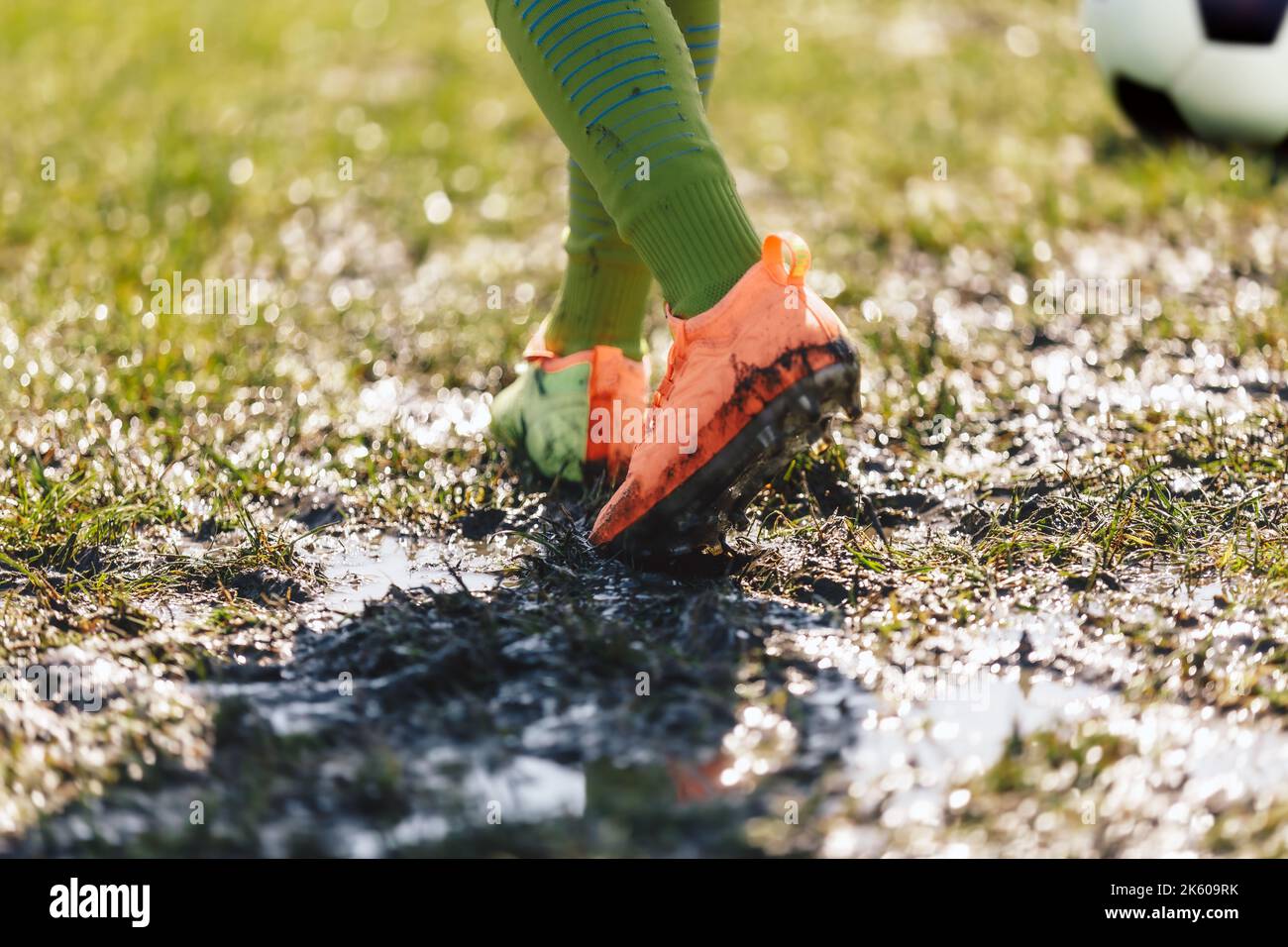 Muddy Football Field. Player Walking On Muddy Soccer Pitch. Soccer ...