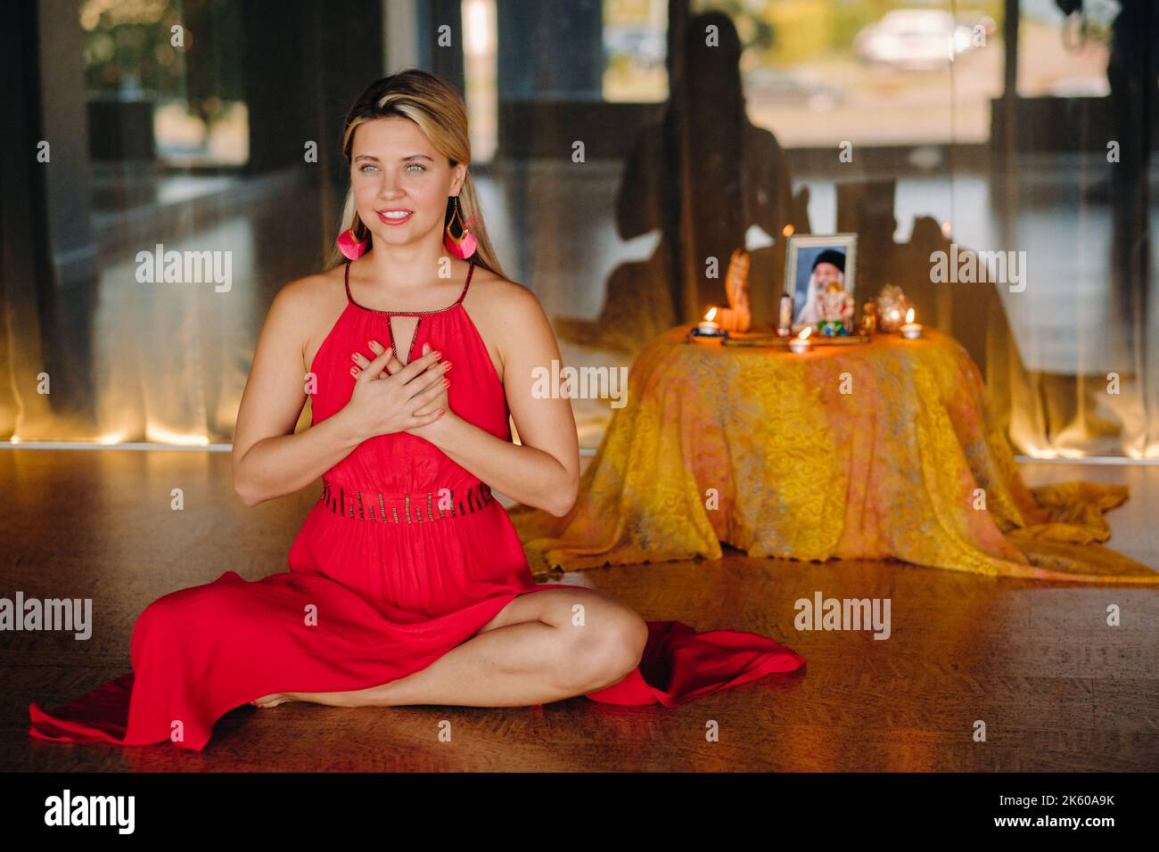 Meditation and concentration. a woman in a red dress sitting on the ...