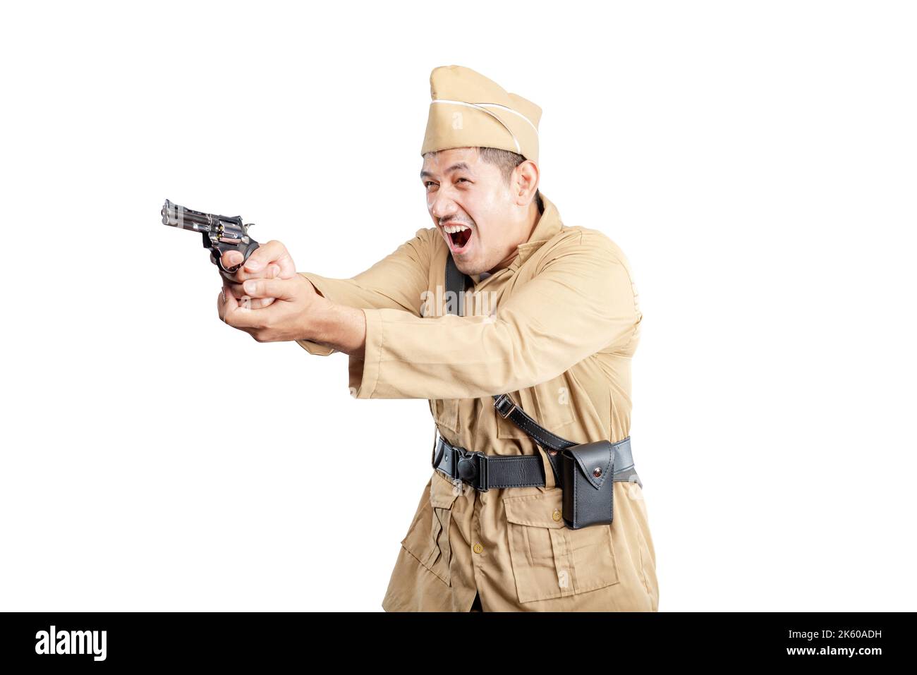 Indonesian freedom fighter standing while holding gun isolated over ...