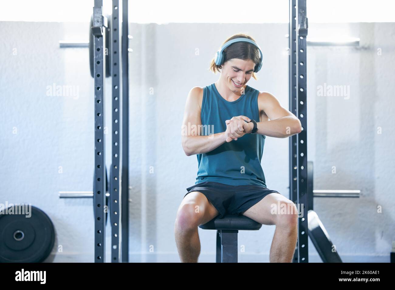 Fitness, man checking time and exercise for sports training monitoring ...