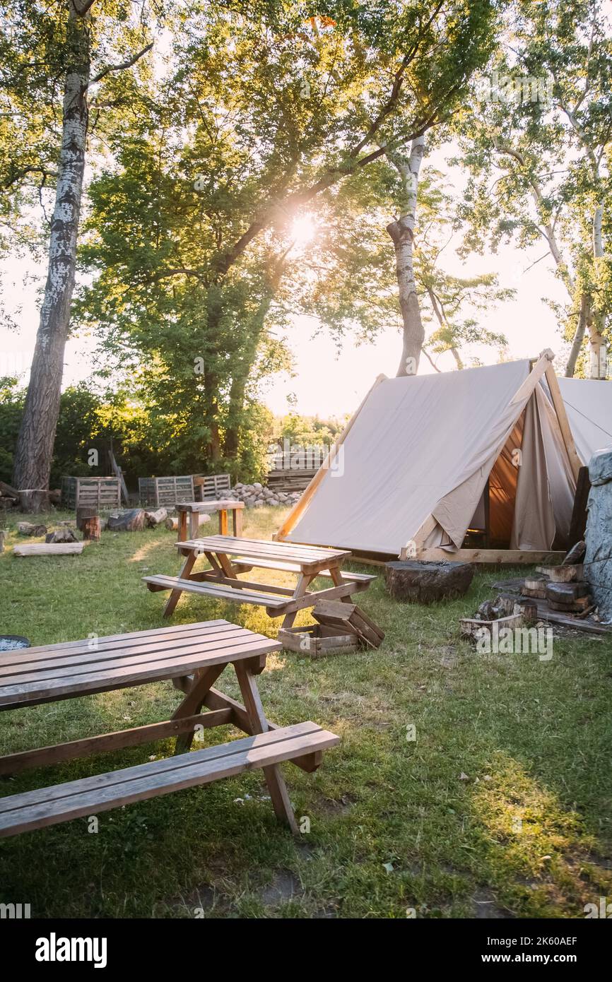 Countryside camping. Nature relax. Orchard stuff. Cozy canvas tent with ...