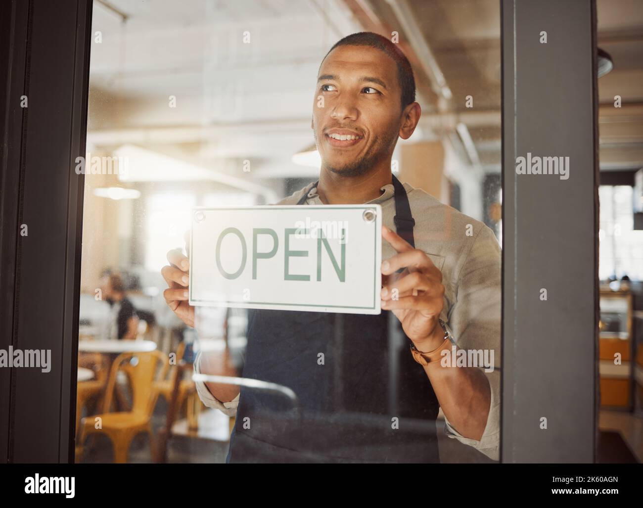Coffeeshop owner hanging an open sign in shop entrance. Businessman ...