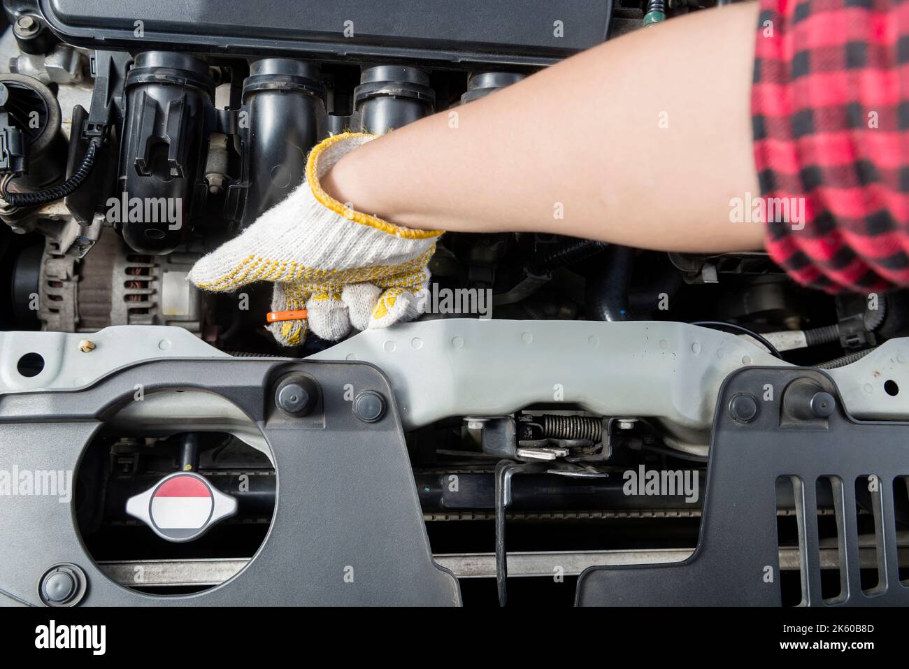 Car mechanic working on engine repair in the garage Stock Photo - Alamy