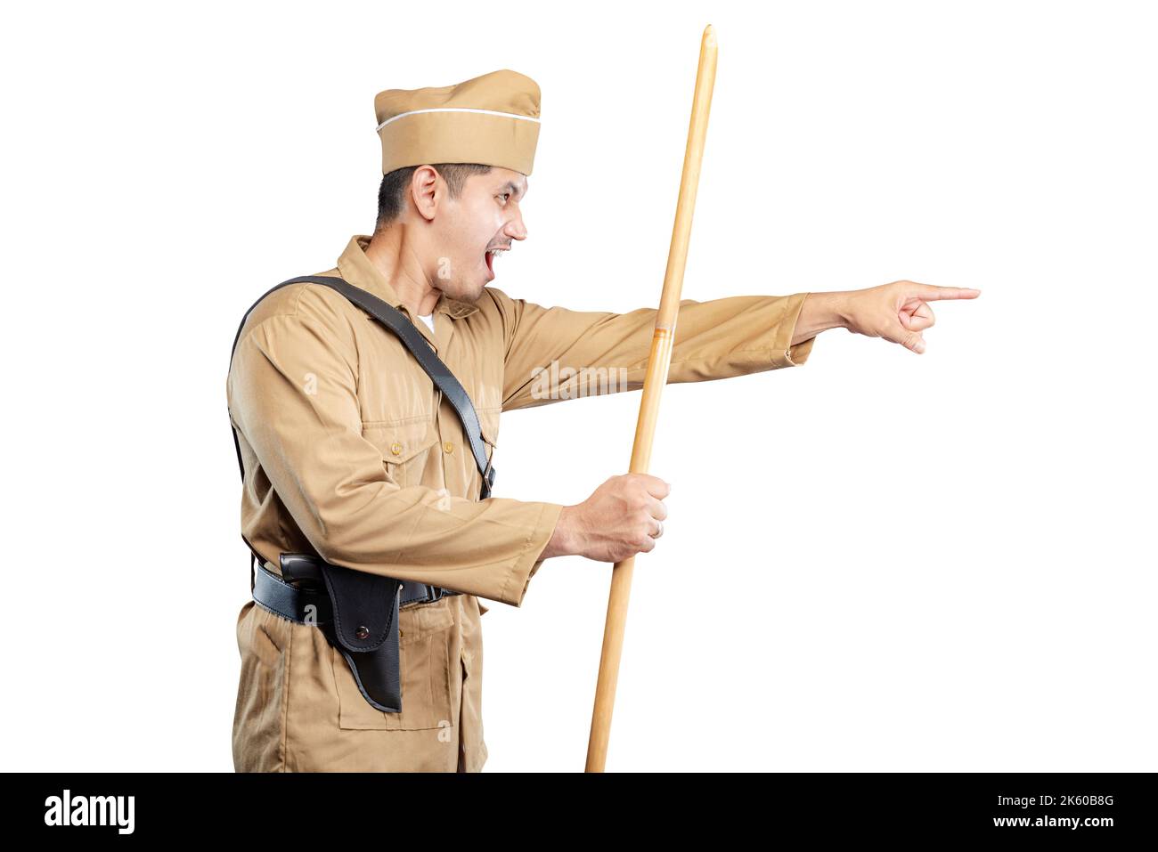 Indonesian freedom fighter standing while holding sharpened bamboo ...