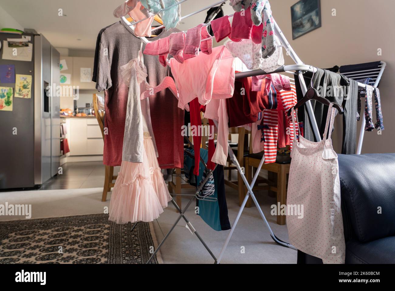 Washing - children and adult's clothes - drying on a drying rack in a ...