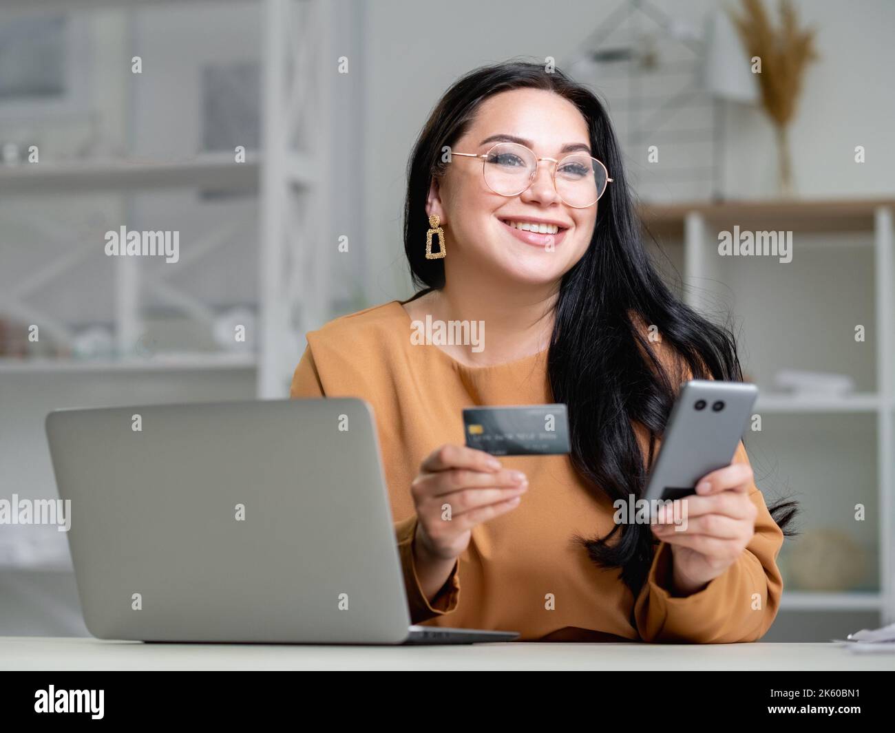 online payment happy woman corporate order Stock Photo - Alamy