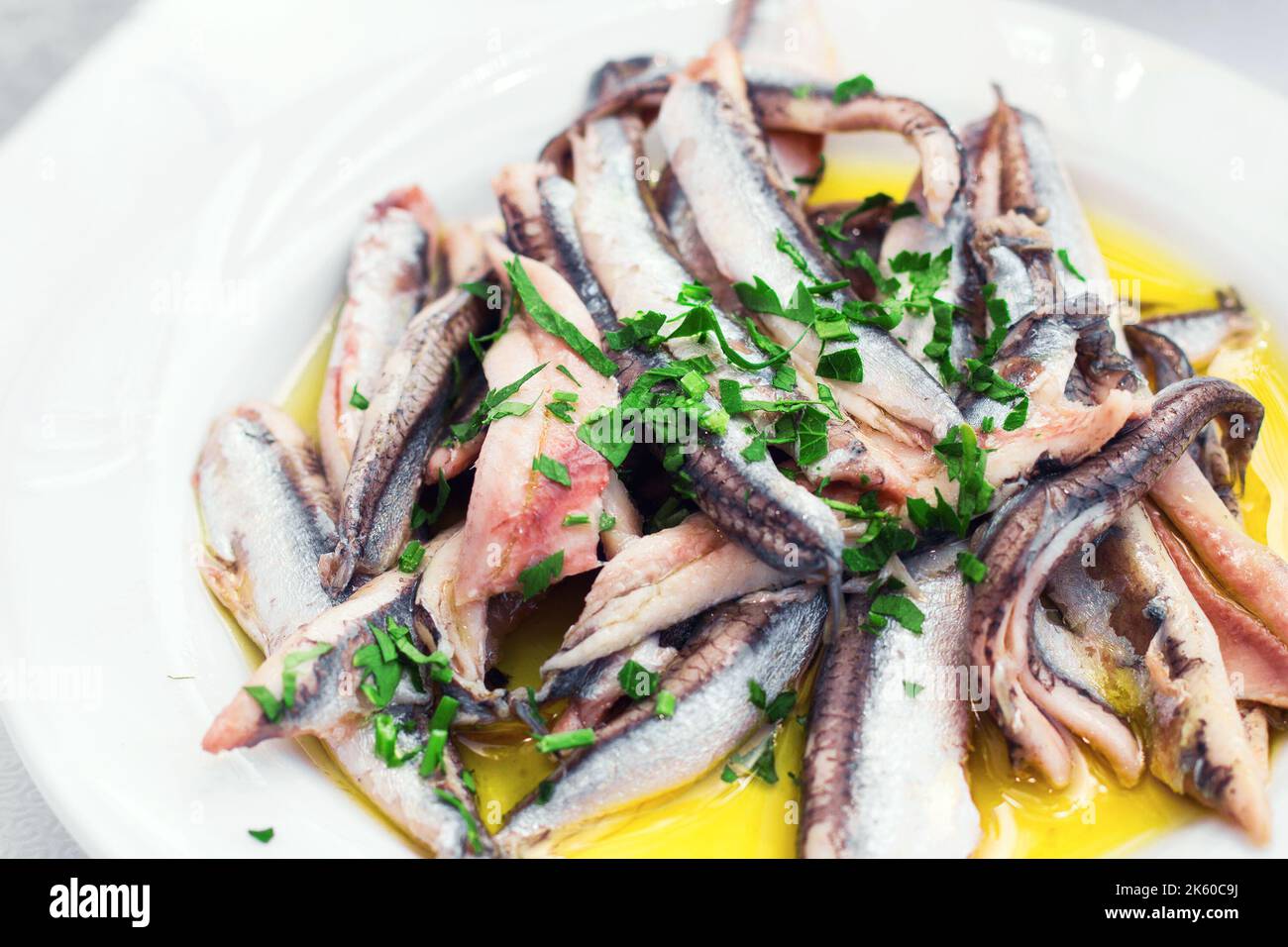 Marinated anchovies in olive oil (selective focus Stock Photo - Alamy