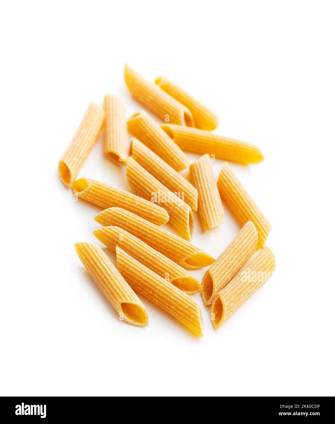 Uncooked whole grain pasta isolated on the white background. Raw penne ...