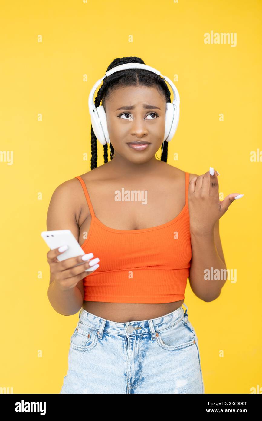 bad music playlist dislike african woman earphones Stock Photo - Alamy