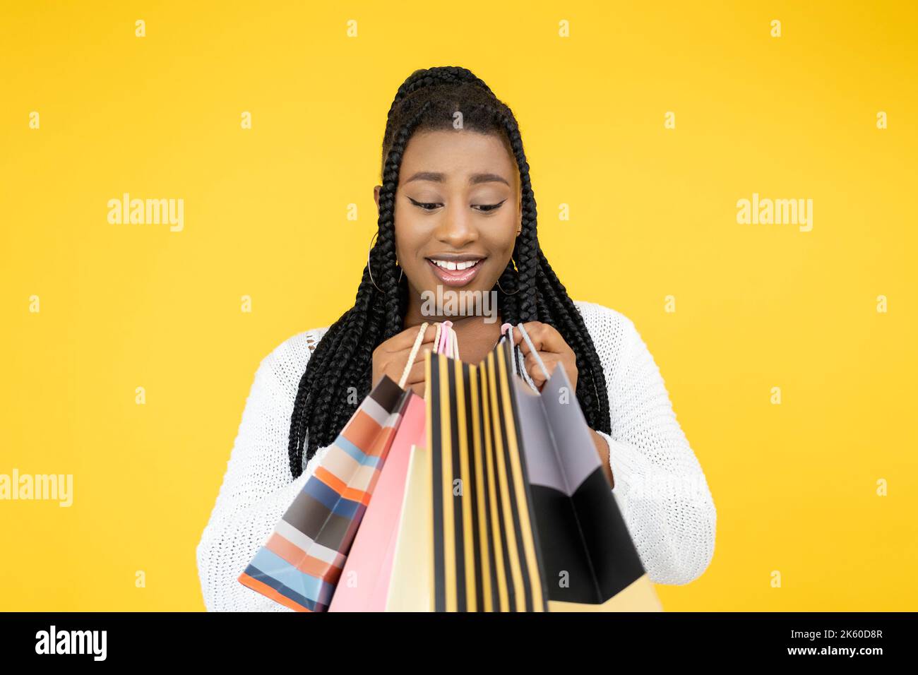shopping bonus friday african woman bags Stock Photo - Alamy