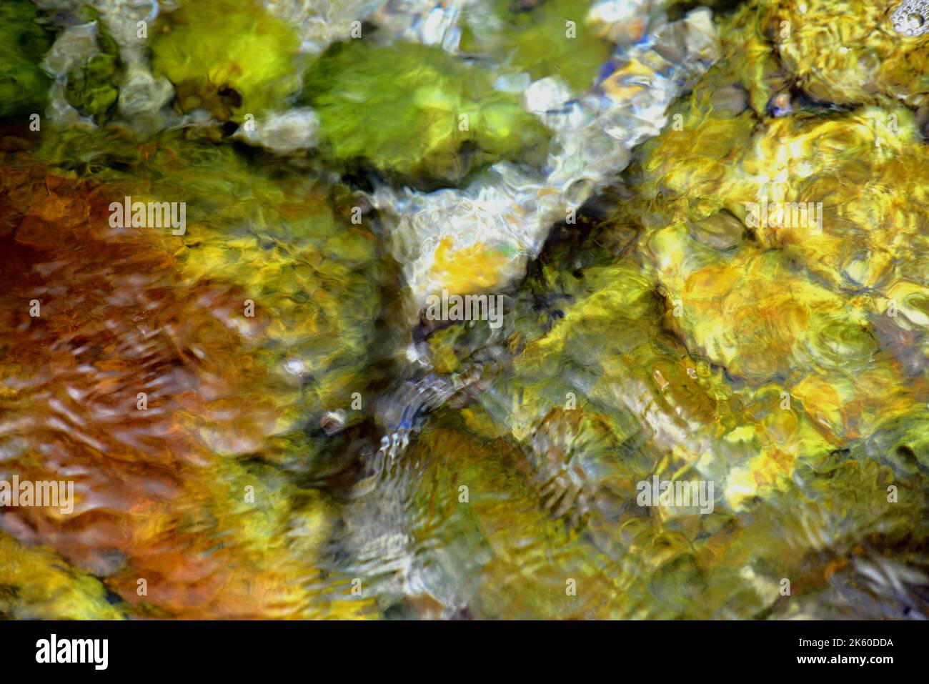Abstract of refraction and diffraction of light on moving water Stock ...