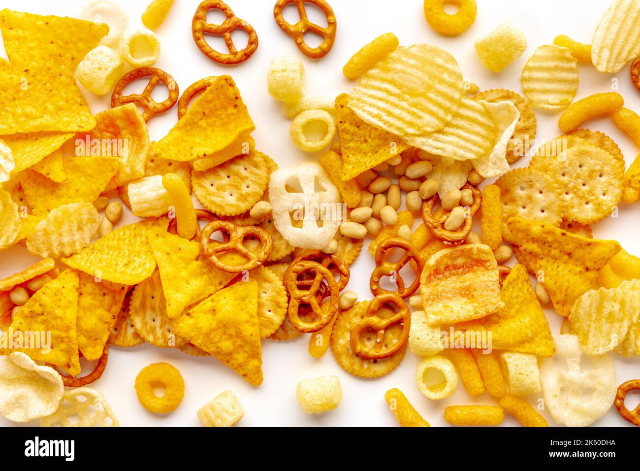 Salty snacks texture on a white background. Party food assorted mix ...