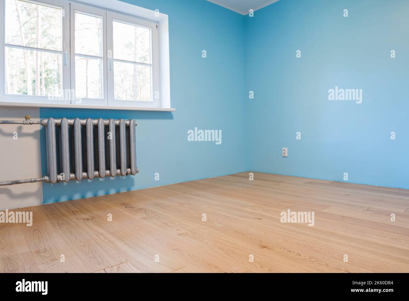 New home construction interior room with wooden floors and windows ...