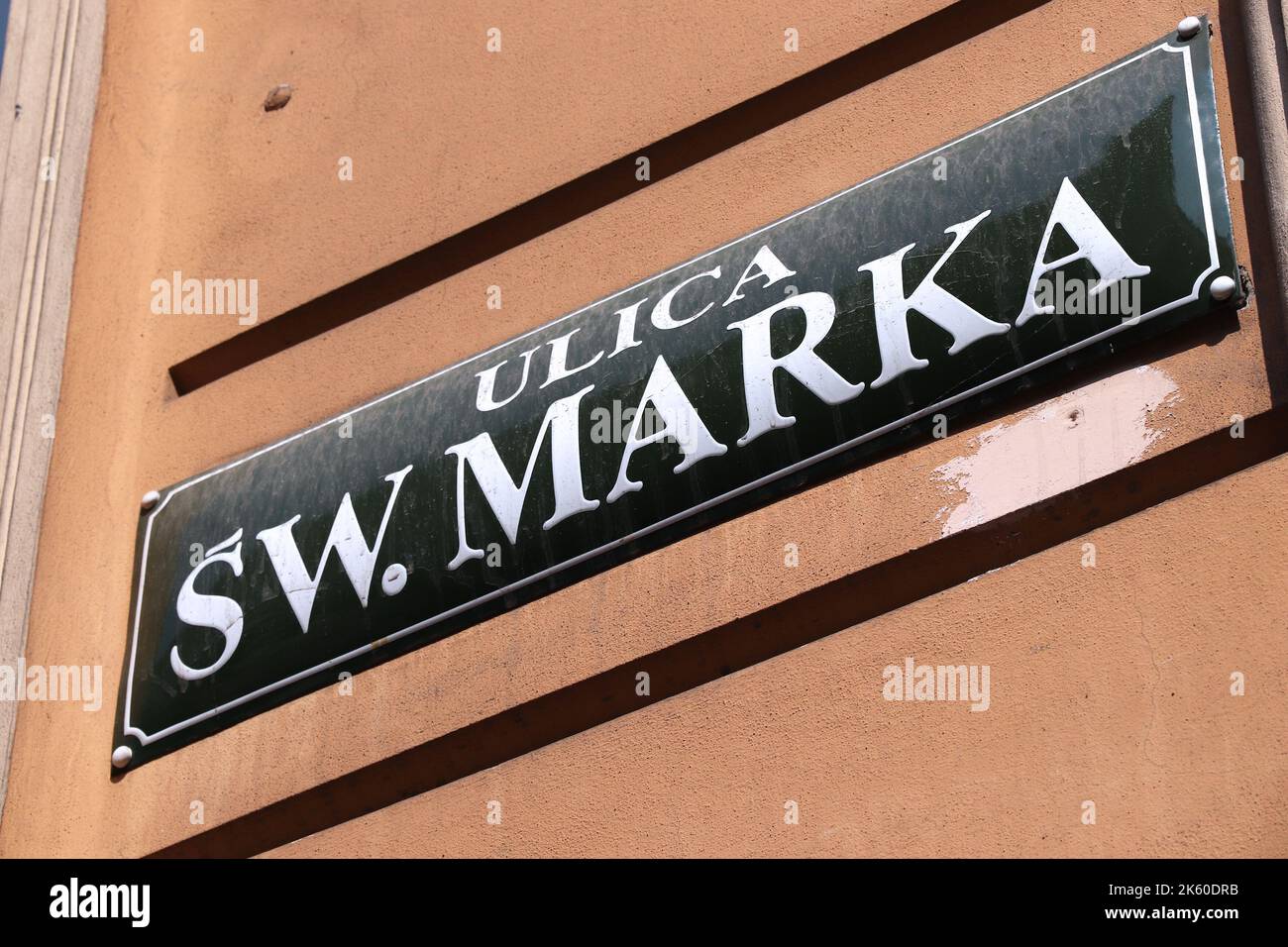 Krakow Old Town in Poland. Street name sign: Sw. Marka street Stock ...