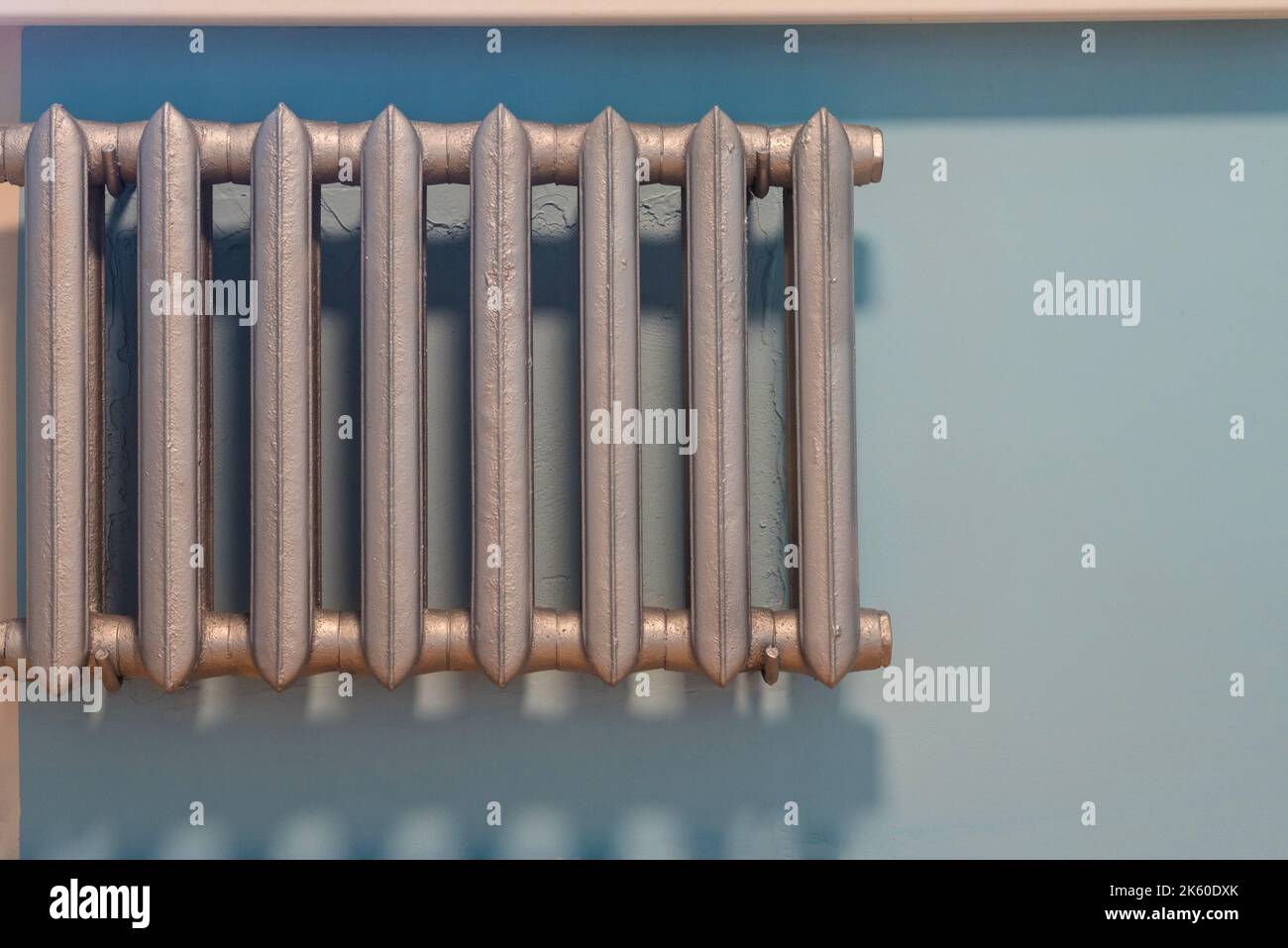 Cast iron radiator of water on the wall Stock Photo - Alamy