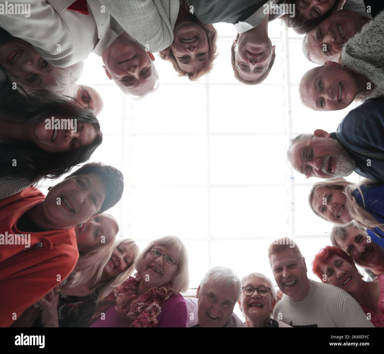 Happy people looking down at camera Stock Photo - Alamy