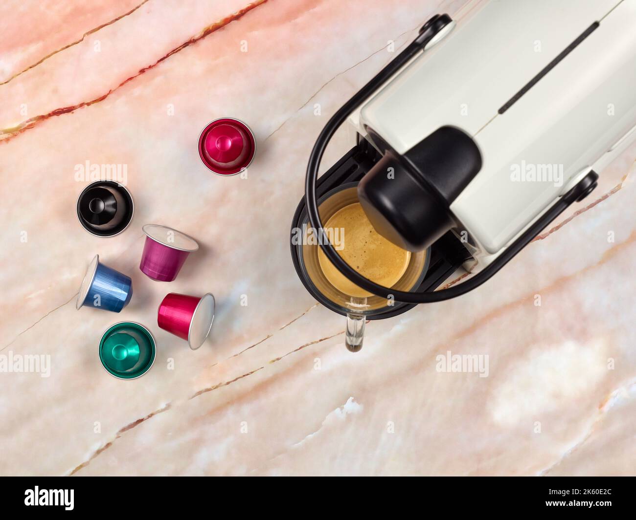 Capsule coffee machine and coffee capsules of different colors Stock ...