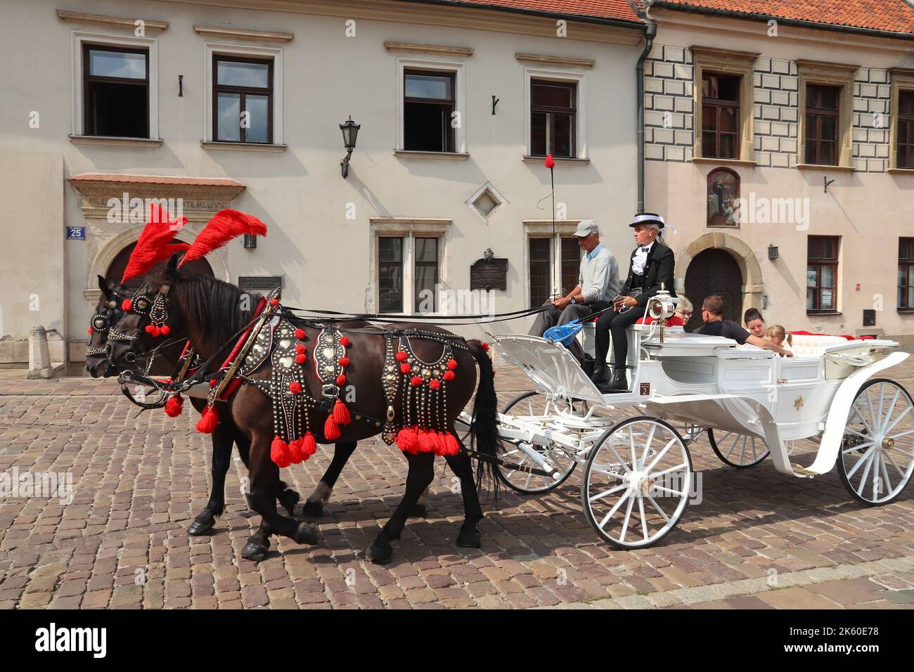 KRAKOW, POLAND - AUGUST 28, 2018: People ride a horse carriage in ...