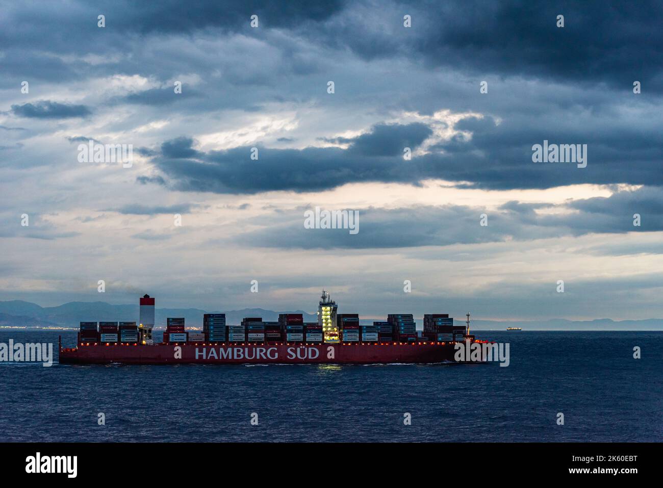 Dramatic sky and clouds over Container Ship at dawn, Valencia, Spain ...